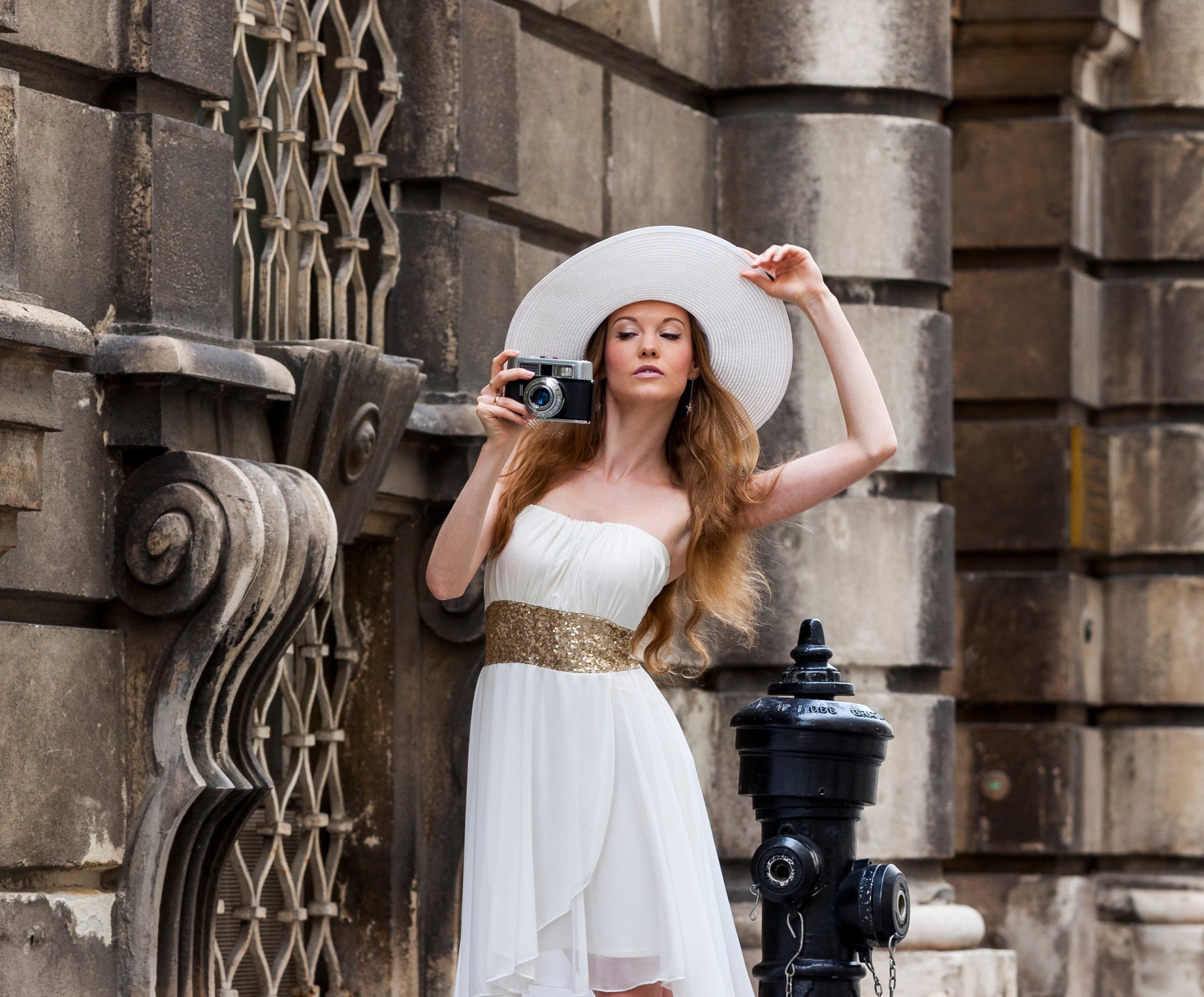 Download Camera Hat Long Hair Redhead White Dress Woman Model HD Wallpaper