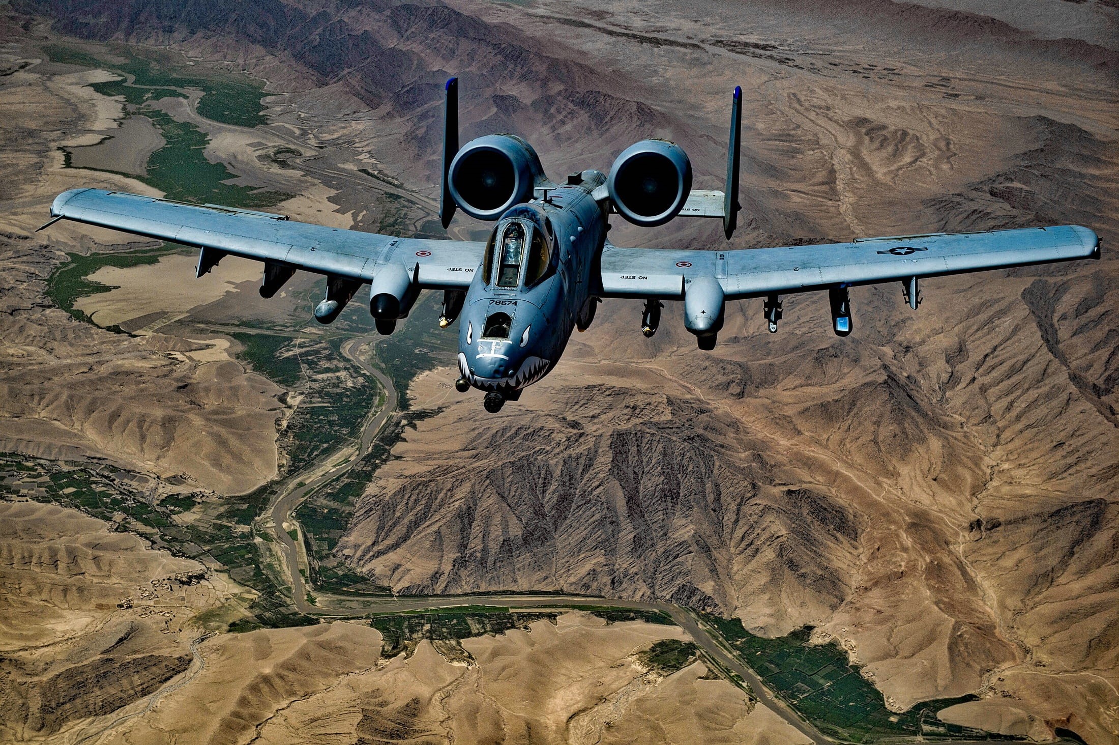 A-10 Thunderbolt II Warrior Over Rugged Terrain | HD Military Wallpaper