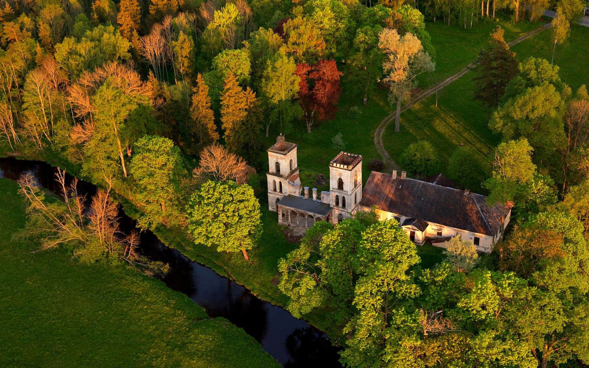 Majestic Mansion Amidst Vibrant Autumn Woods – HD Wallpaper