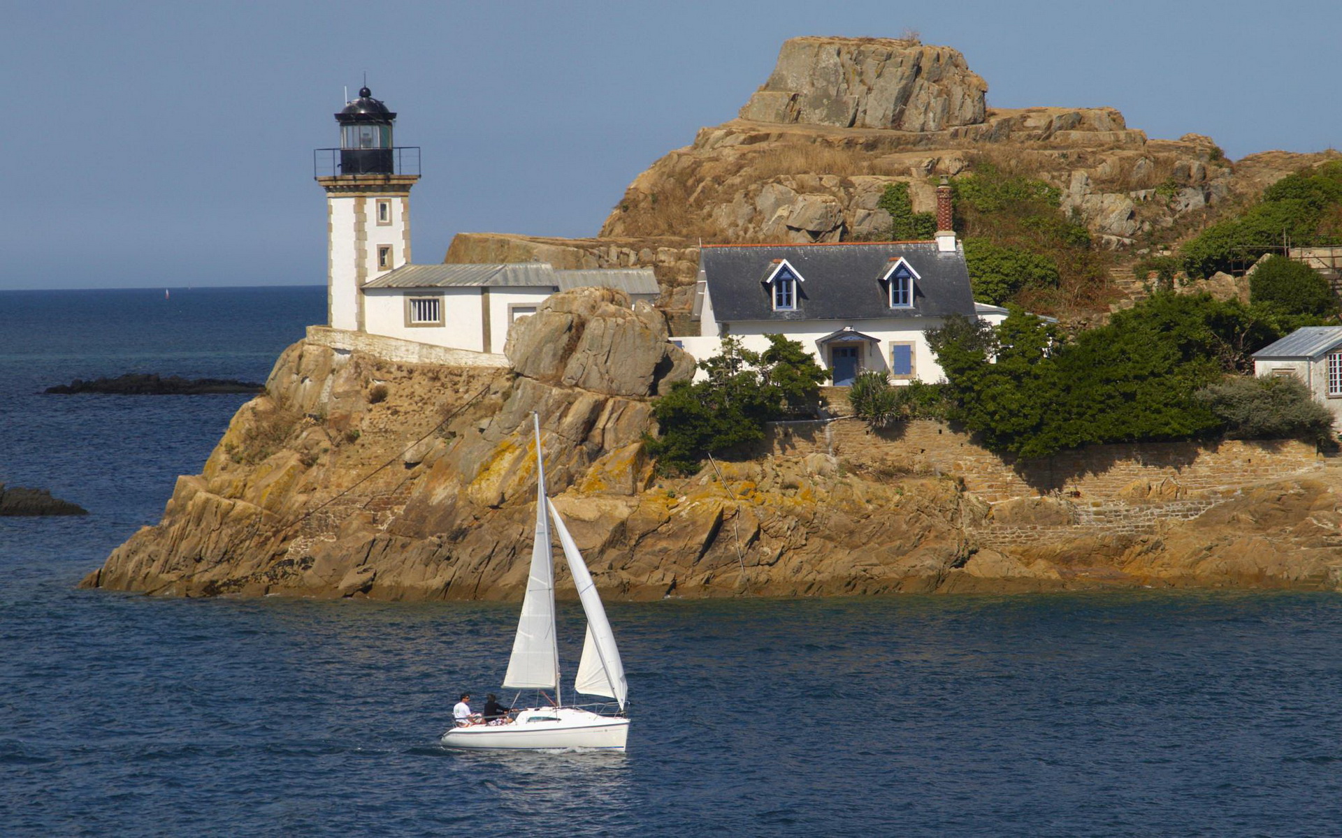 Coastal Serenity: HD Lighthouse and Sailboat Vista