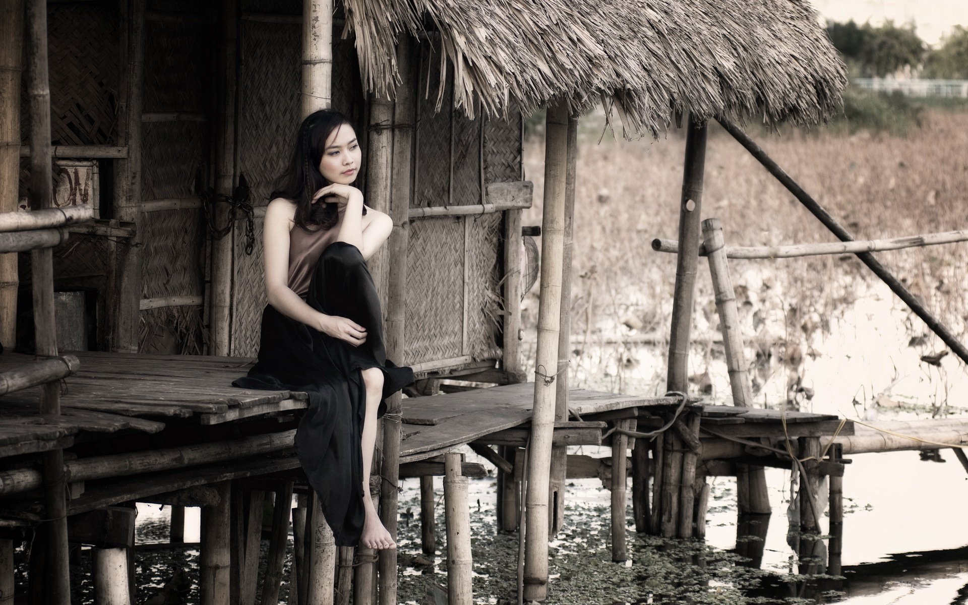 Serene Asian Woman by the Hut - HD Wallpaper