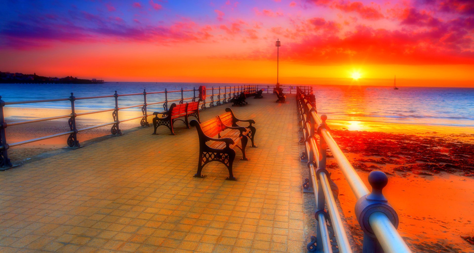 Sunset Serenity: Vibrant HDR Ocean Pier with Golden Benches