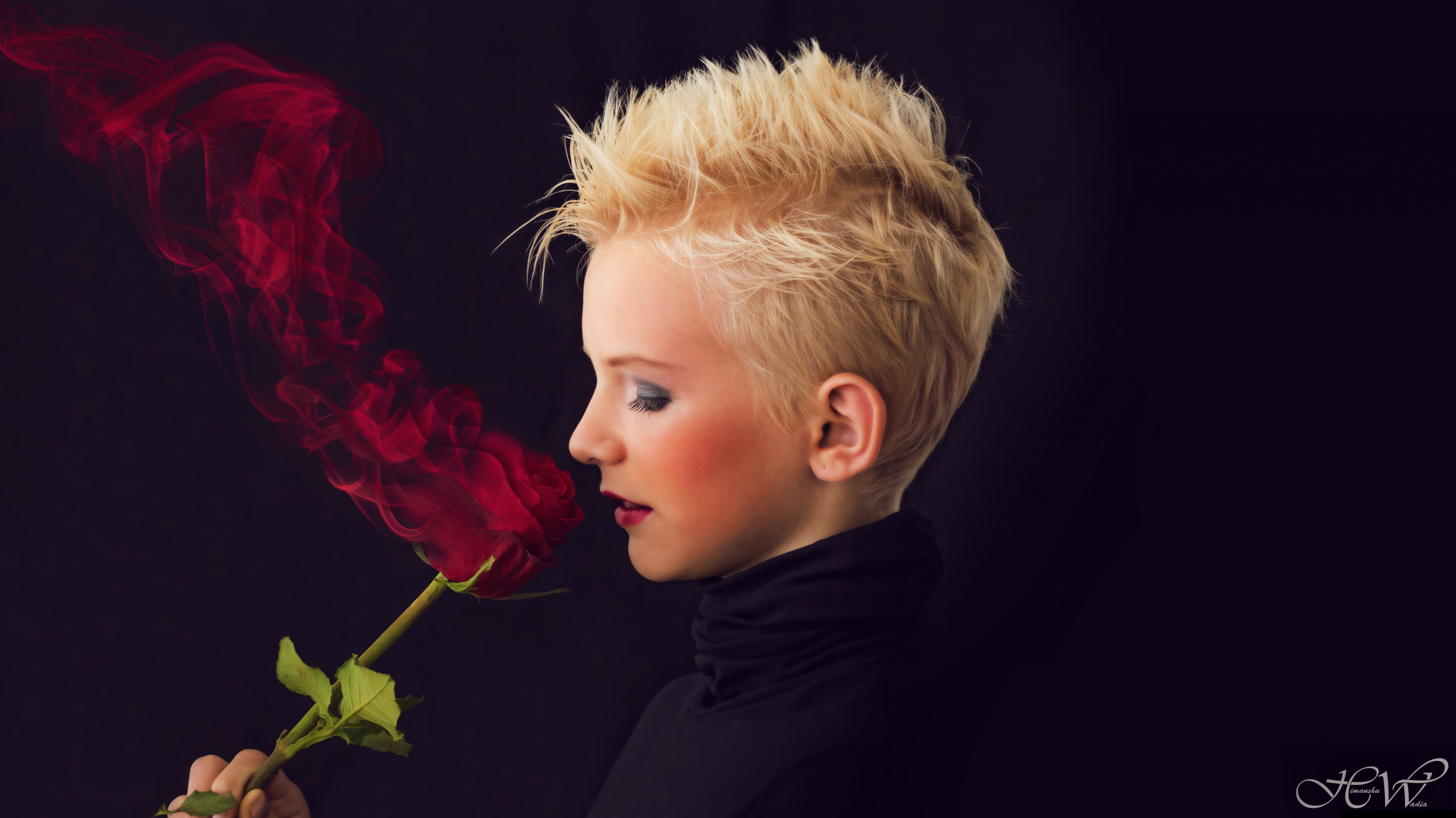 Elegant Beauty: Woman With a Red Rose in 4K Ultra HD