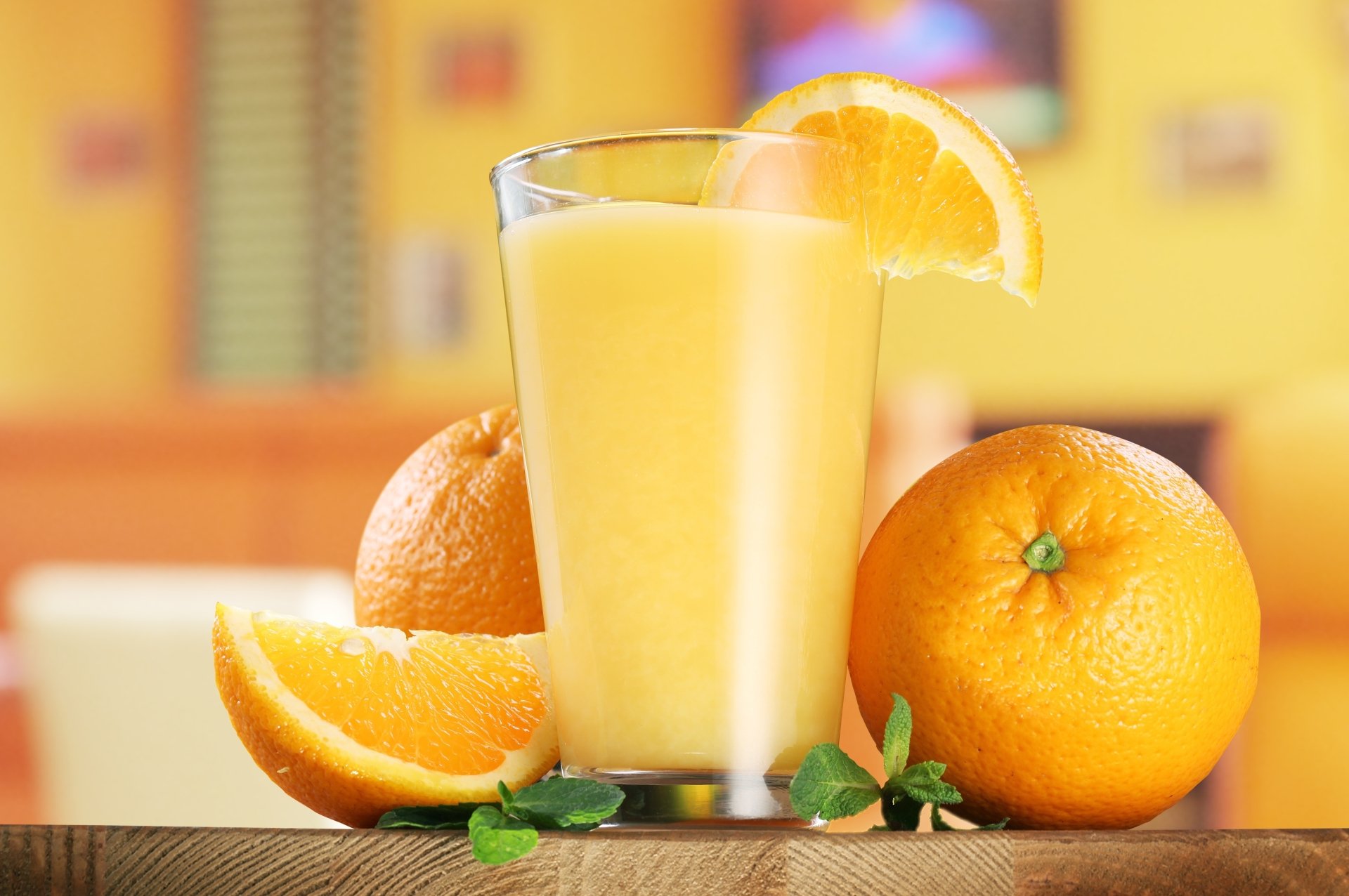 Refreshing 4K Ultra HD Orange Juice Glass with Fresh Fruit Splash