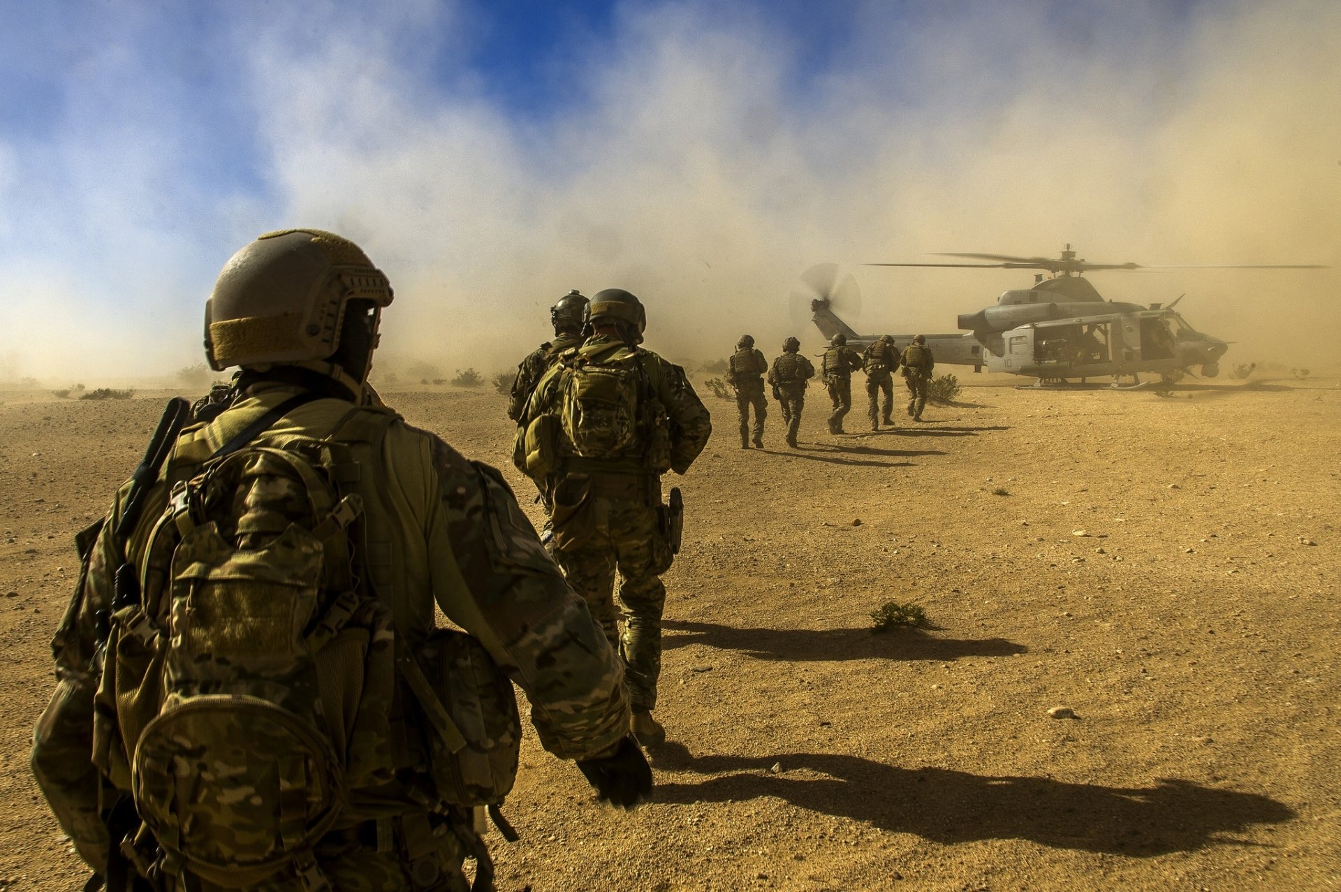 Desert Mission: Military Soldiers and Helicopter in Action – HD Wallpaper