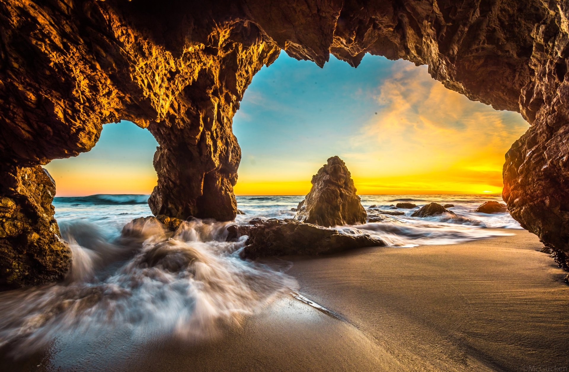 4K Ultra HD Ocean Horizon View from a Sunlit Sand Cave at Dawn