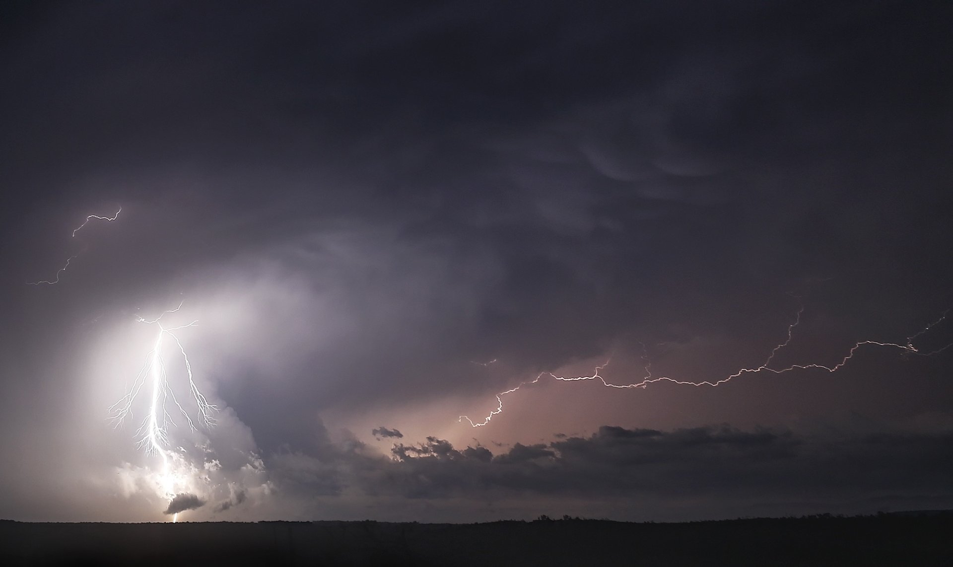 HD Night Storm: Electrifying Lightning Over Nature’s Dark Clouds