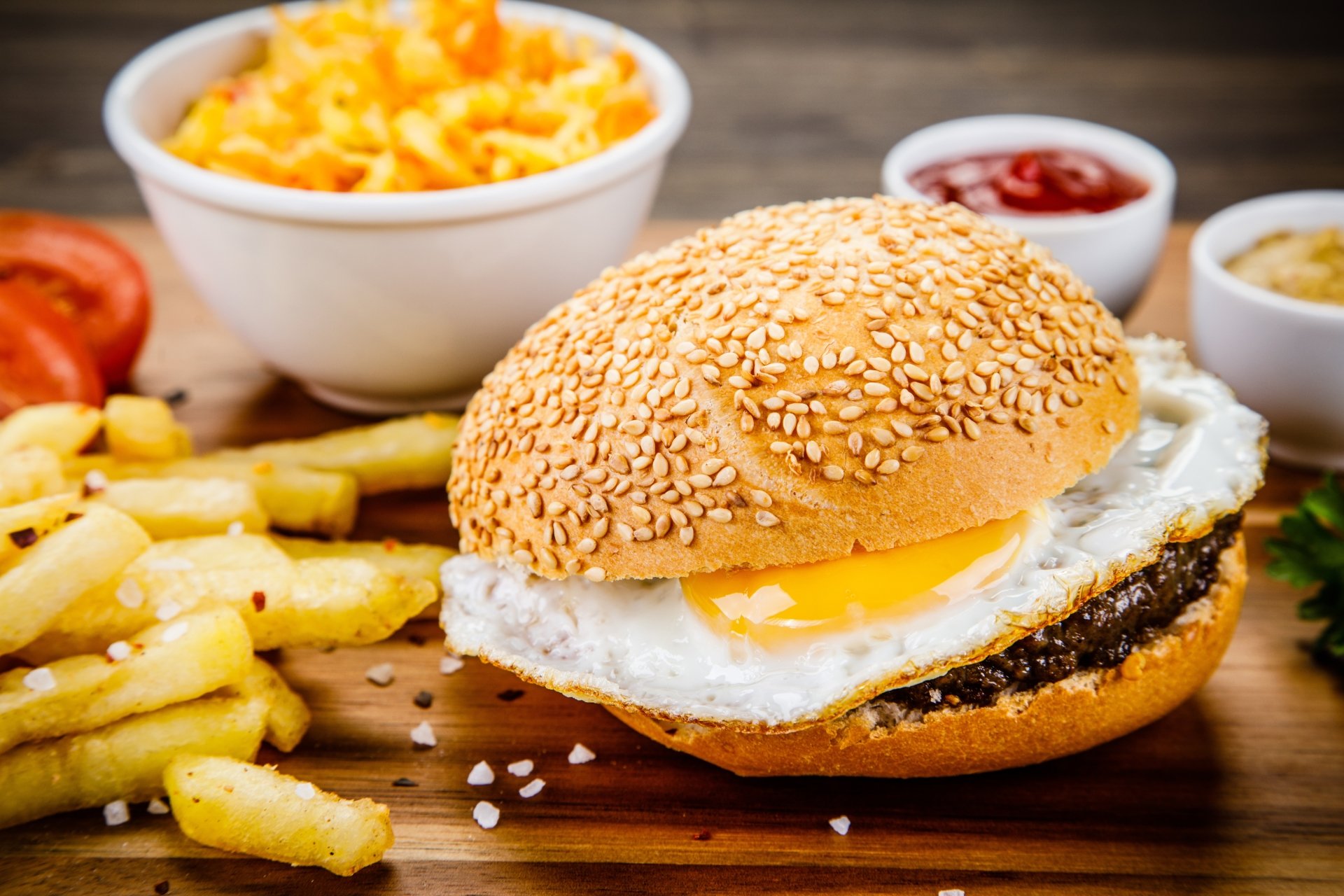 4K Ultra HD Gourmet Burger with Fried Egg & Crispy French Fries Delight